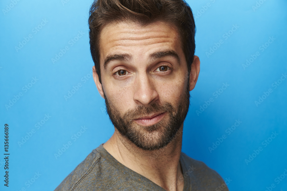 Smug dude looking at camera Stock Photo | Adobe Stock