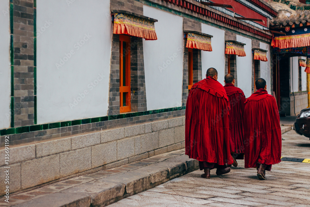 QINGHAI, CHINA - October 4, 2016: Tibetan monks in the ancient temple ...