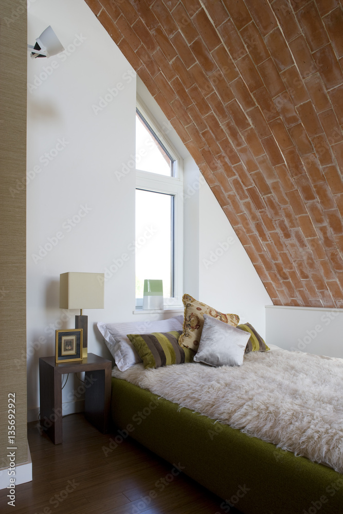 Brick vaulted ceiling in the bedroom of a carbon neutral home Stock ...