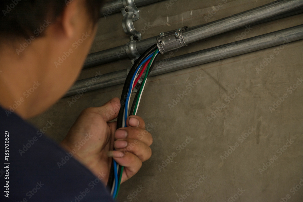 electrical cable in galvanized conduit pipe connection Stock Photo ...