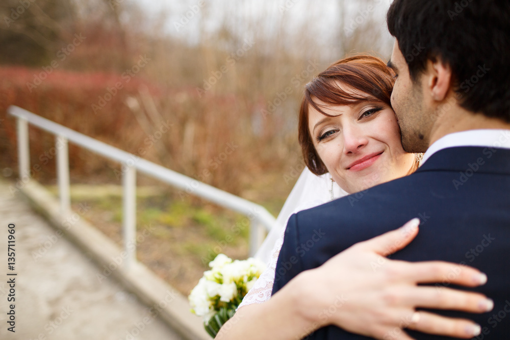 Sensual happy smiling bride hugging handsome groom, face closeup Stock ...