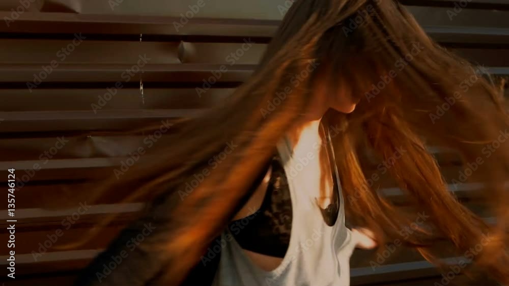 Teenage girl turning with her hair fly in an air. Young Woman with ...