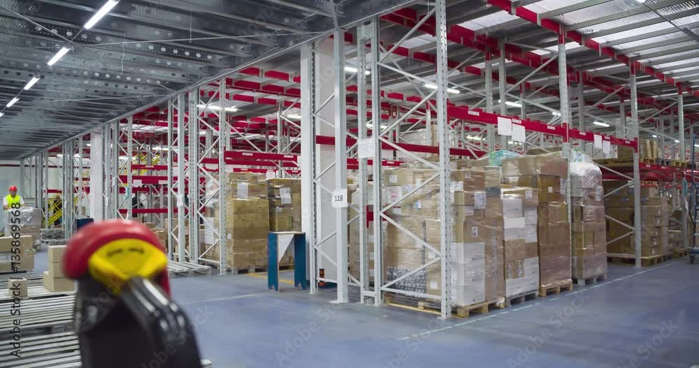 Warehouse worker transports boxes on trolley loader 4k video. Delivery ...