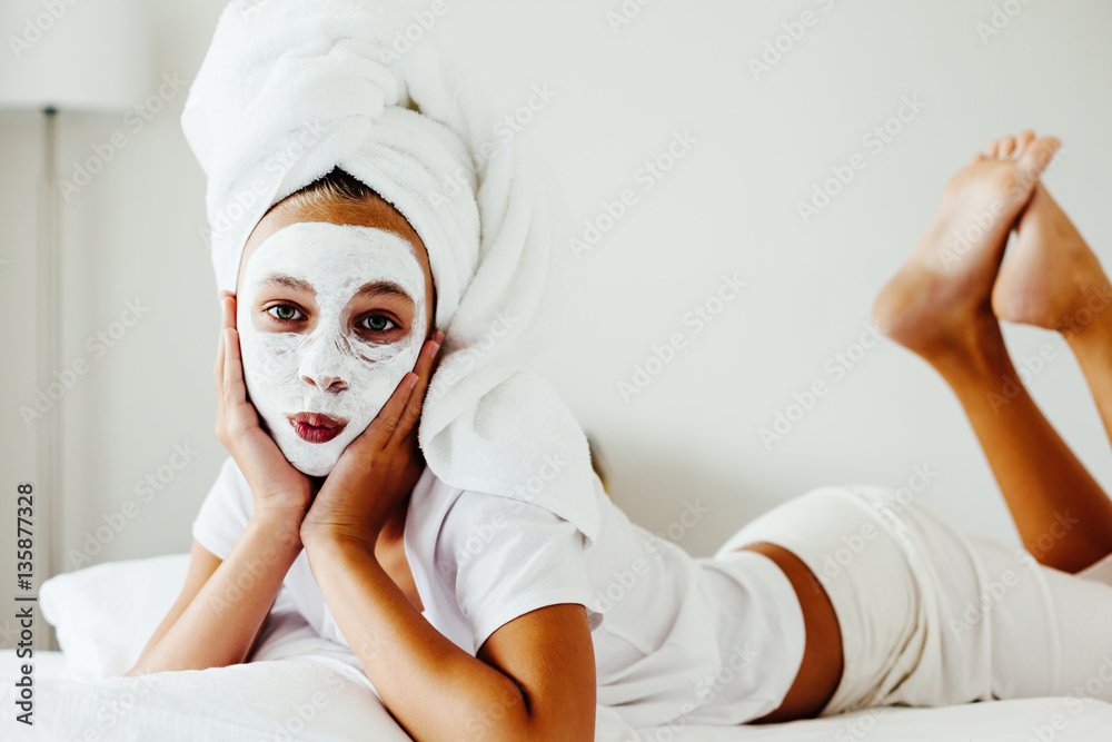 Teenage girl making facial mask Stock Photo | Adobe Stock