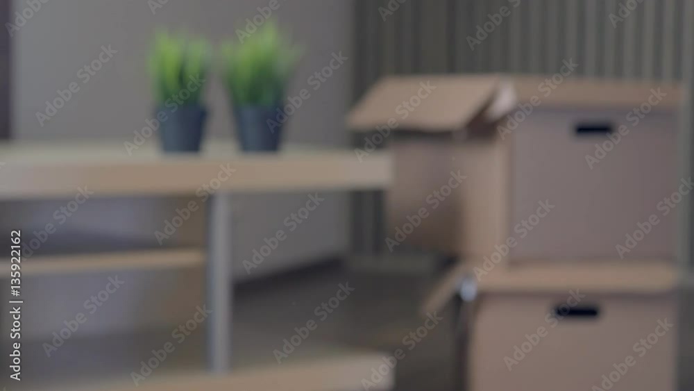 Woman handing out a set of keys to another, Mother giving a key to his ...