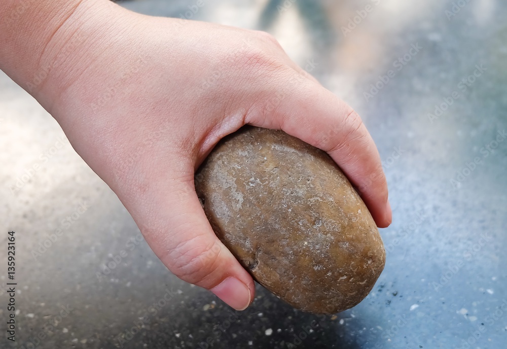 Hand Holding A Pieces of Pebble Rock Stock Photo | Adobe Stock
