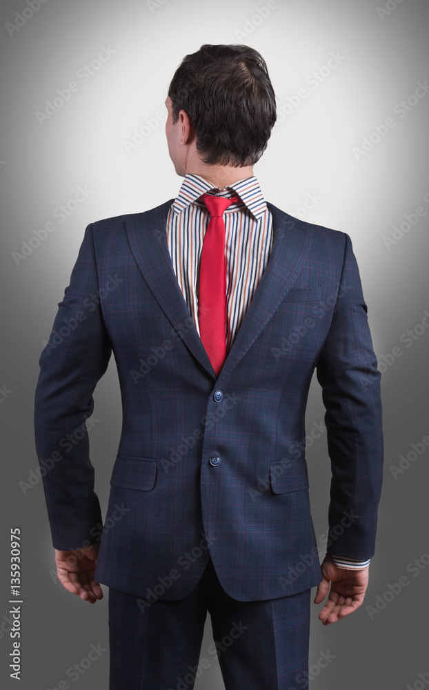 Man wearing his suit on backwards Stock Photo | Adobe Stock