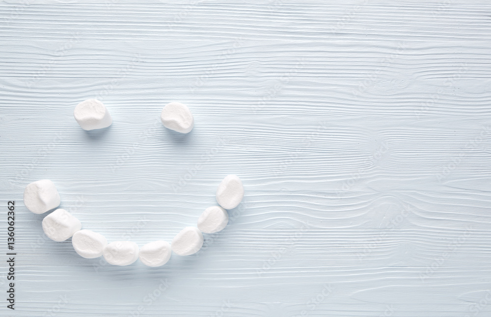 Smiley marshmallow on a light background. Stock Photo | Adobe Stock
