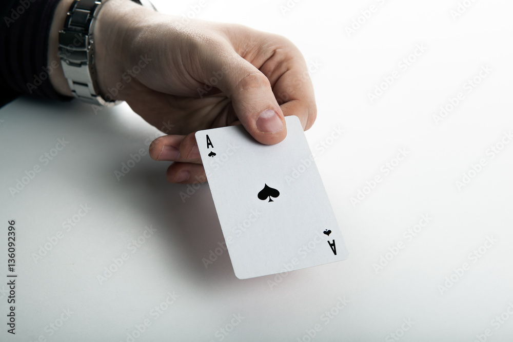 Human hand holding the ace of spades Stock Photo | Adobe Stock