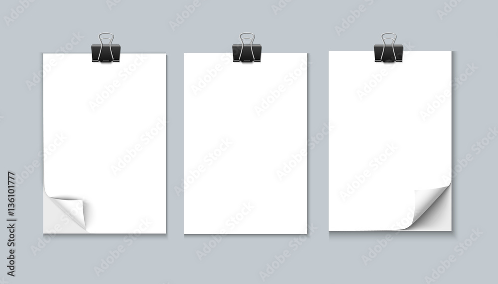 White sheets of paper with paperclip isolated on gray background. A4 ...