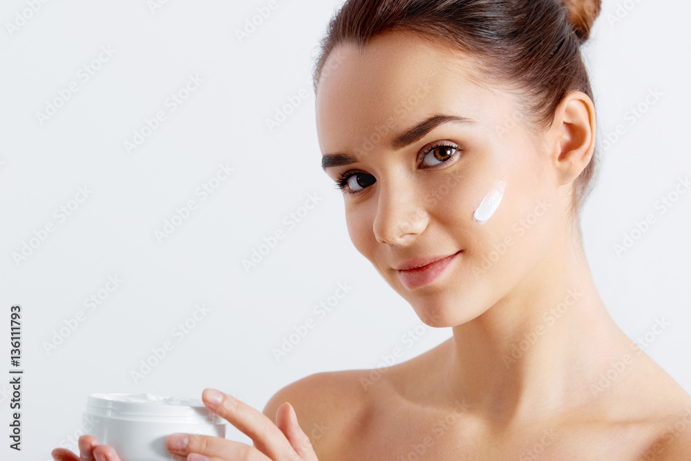 Beautiful woman tender jar of moisturizer cream. Close-up fresh young ...