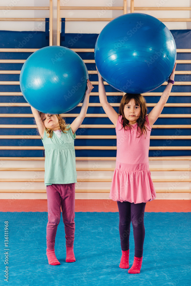 Little girls at physical education class Stock Photo | Adobe Stock