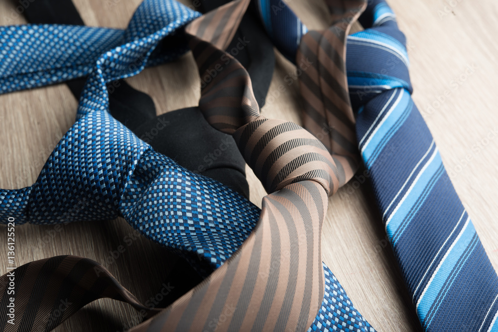 Silk neck ties on wooden background. Stock Photo | Adobe Stock
