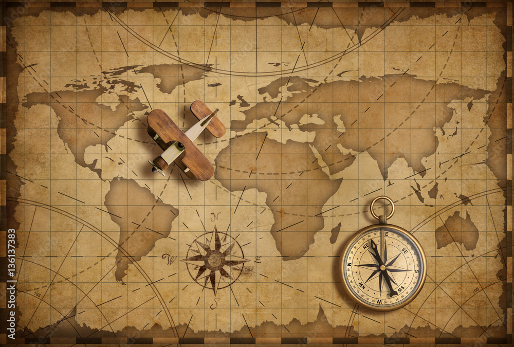 Small wood airplane over world nautical map as travel and communication ...