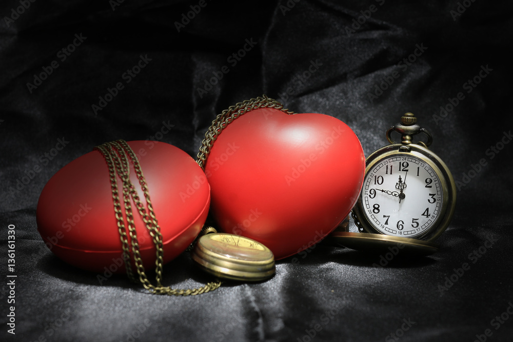vintage clock and red heart on black background ,Love and time concept ...