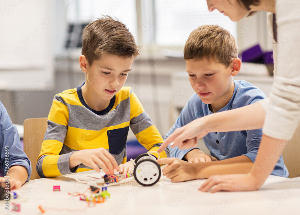 happy children building robot at robotics school Stock Photo | Adobe Stock