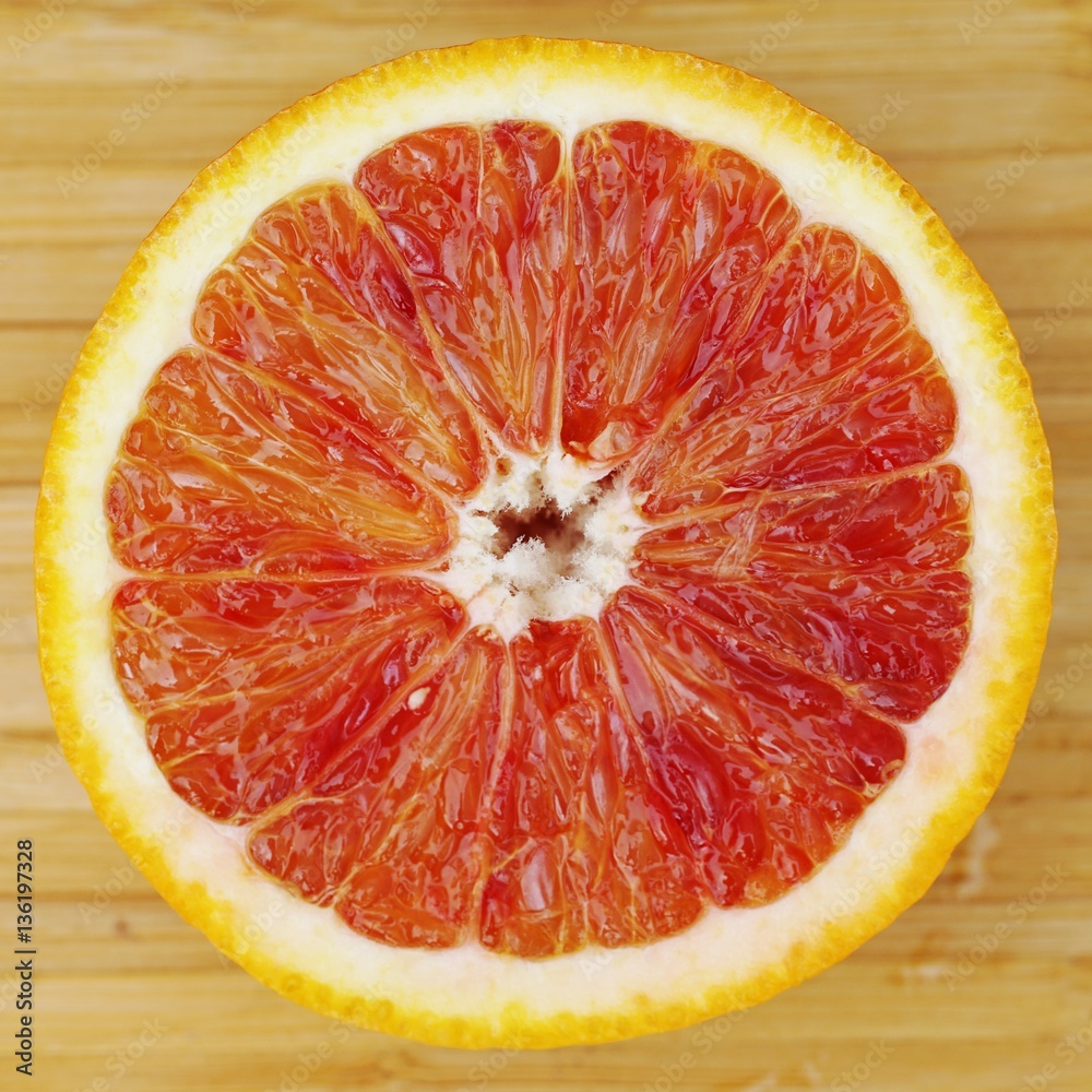 Close-up of a juicy blood orange cut in half Stock Photo | Adobe Stock