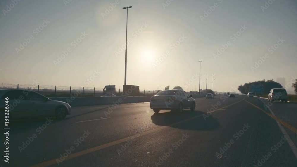 Movement of vehicles on the paved road. City highway. Left-hand traffic ...