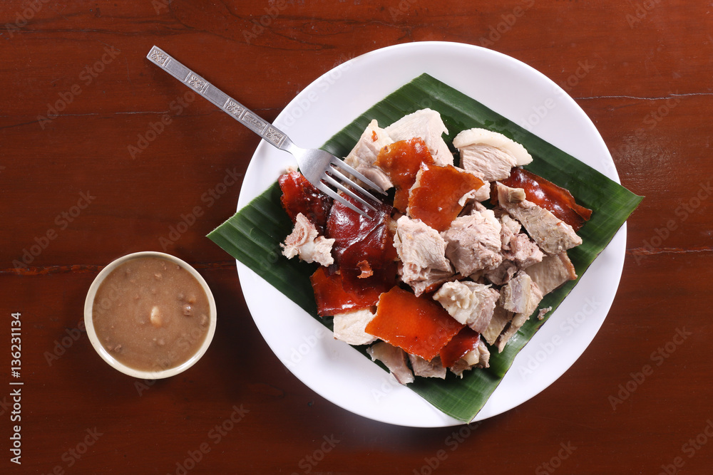 Flat Lay shot of [lechon or suckling pig chopped parts serve with ...
