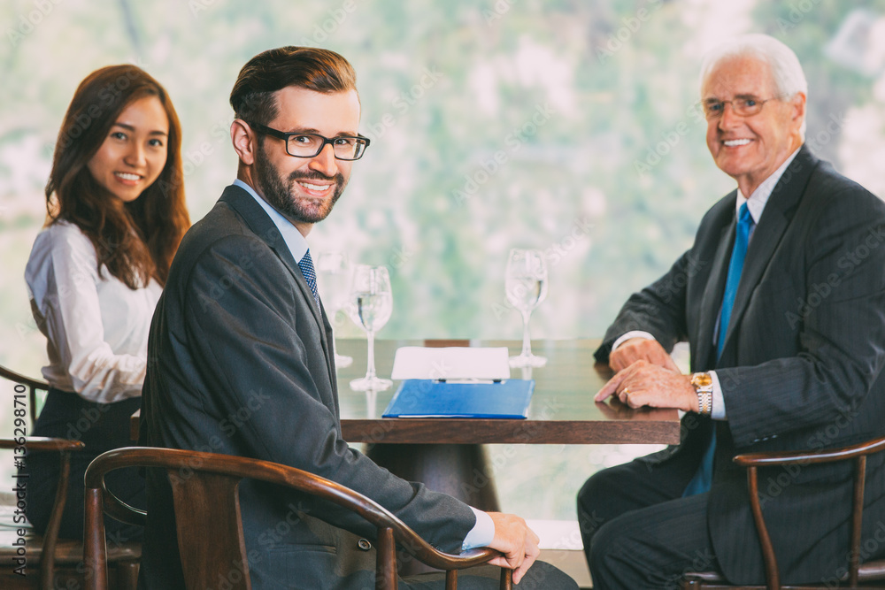 Three Business People Posing to Camera Stock Photo | Adobe Stock
