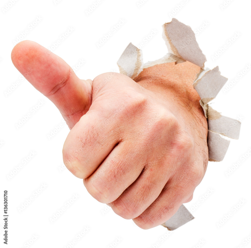 Thumbs up hand sign breaking through thorn paper isolated on white ...
