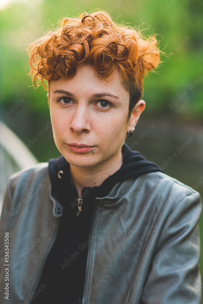 Foto Stock Portrait Of Young Beautiful Lesbian Redhead Woman Looking At