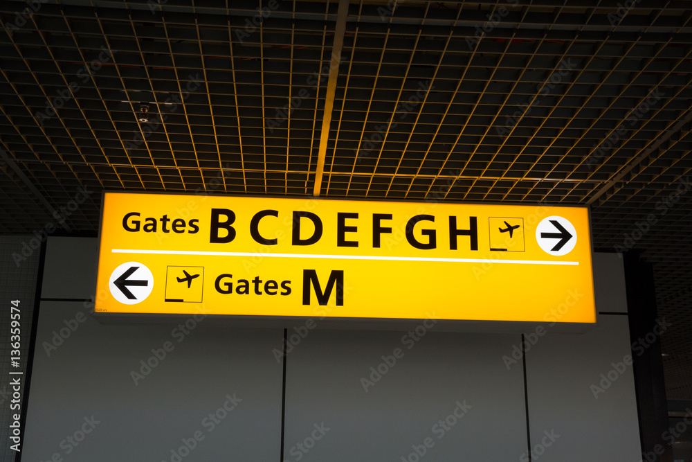 Illuminated sign at airport with gate numbers Stock-Foto | Adobe Stock
