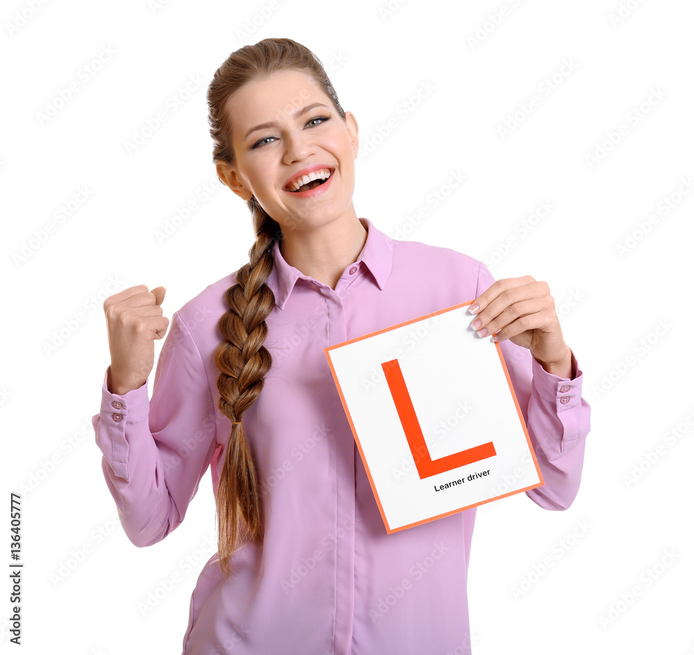 Young woman with learner driver sign on white background Stock-Foto ...