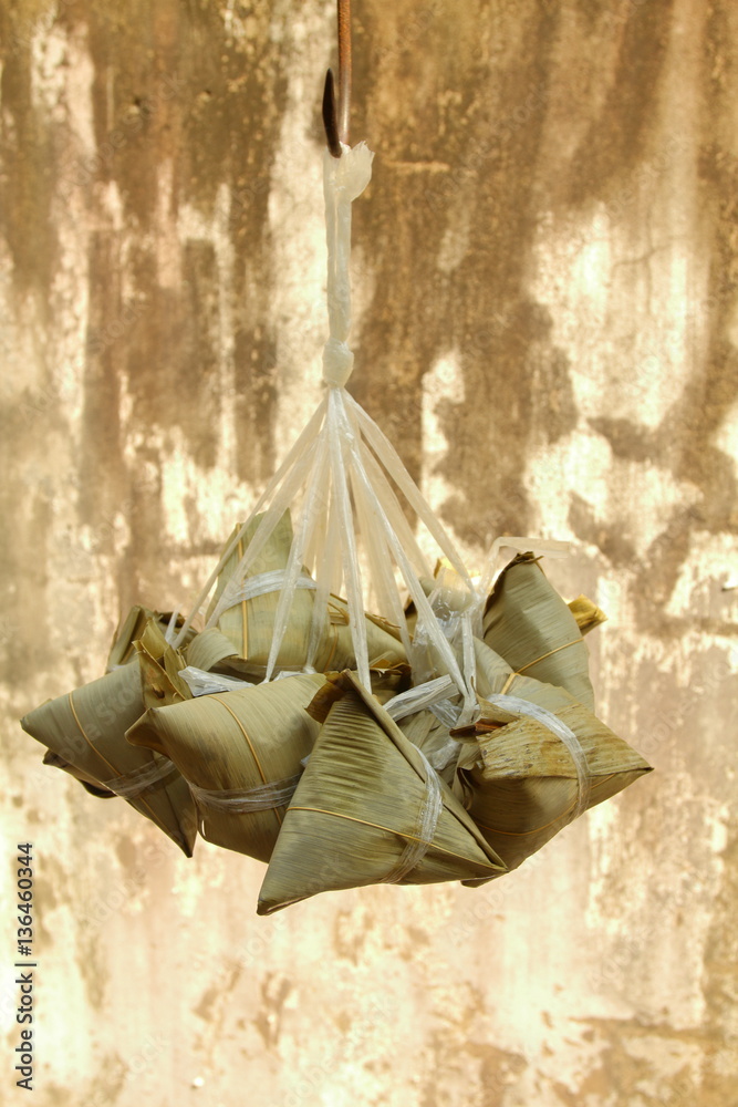 Zongzi, pyramid-shaped sticky, glutinous rice dumplings wrapped by ...