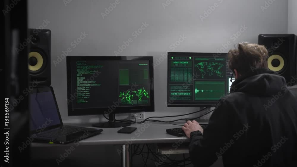 Close up of a spy with smartwatch and mobile phone sitting at the table ...