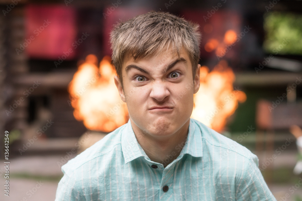Angry teenage boy outraged Stock Photo | Adobe Stock