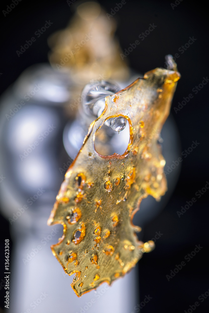 Marijuana oil concentrate aka shatter isolated with glass rig on Stock ...