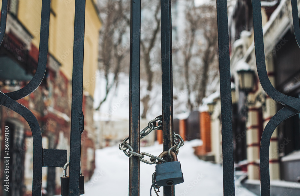 Lock and chain on gates and private residence on background Stock Photo ...