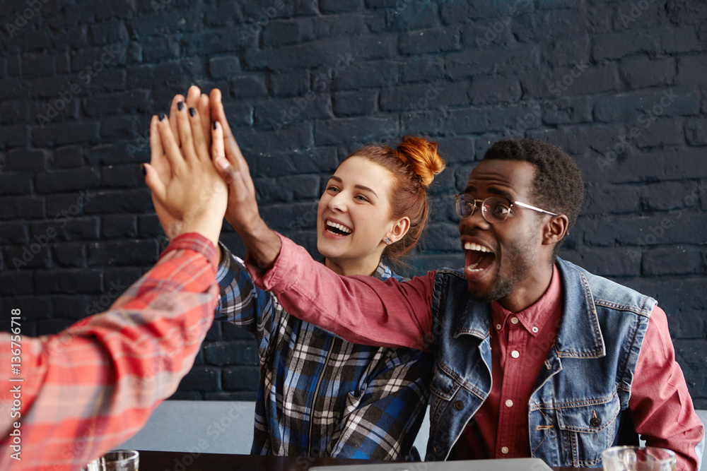 Teamwork, cooperation, partnership and success. Interracial group of ...