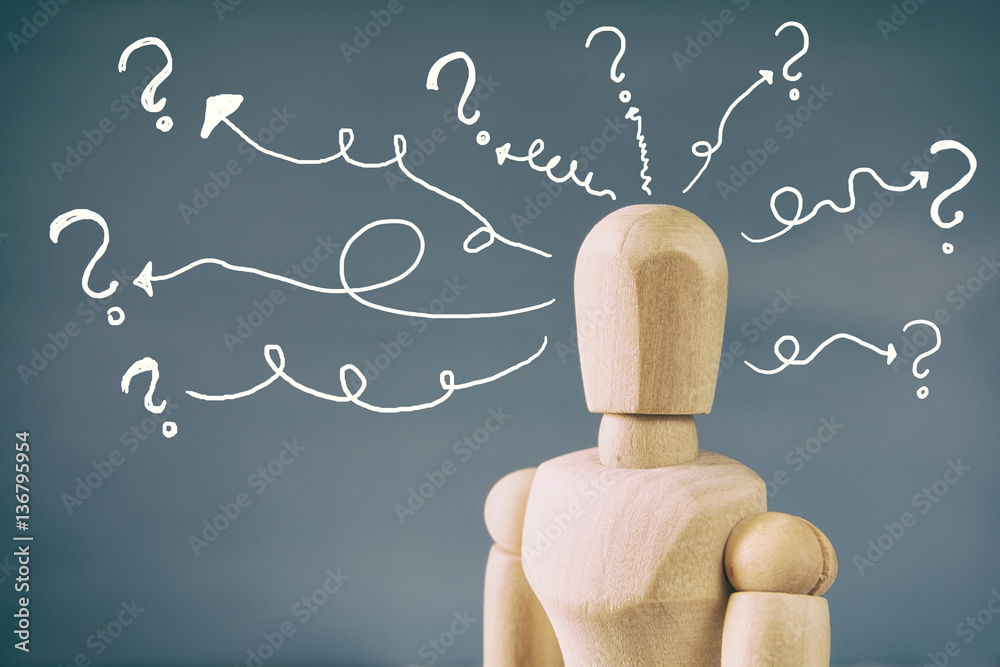 image of wooden dummy with may question marks Stock Photo | Adobe Stock