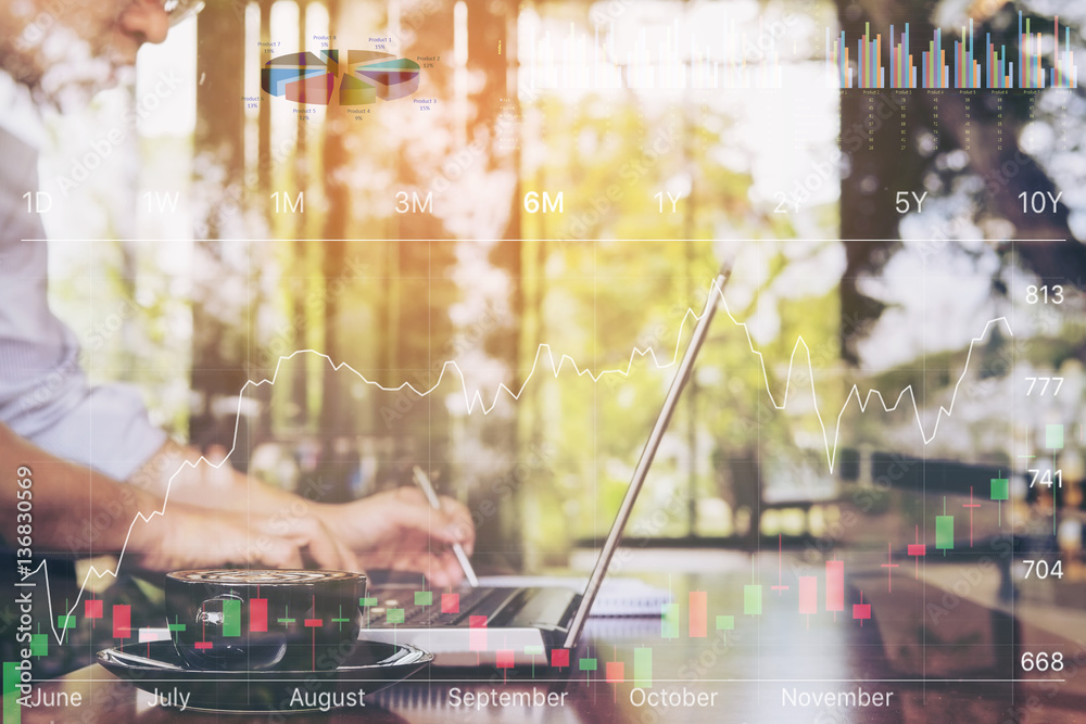 Businessman is working with his computer in coffee shop with stock ...