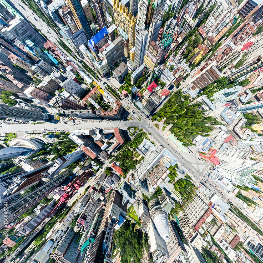 Aerial city view with crossroads, roads, houses, buildings, parks and ...