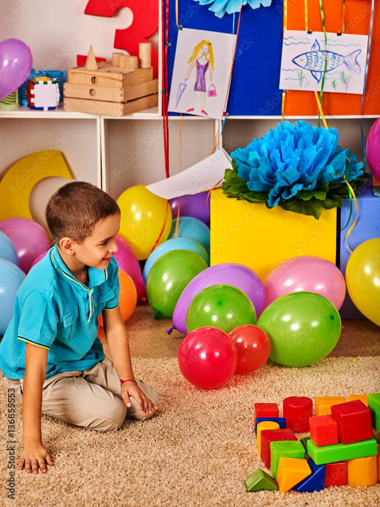 Children playing in kids club indoor. Lesson in primary school ...