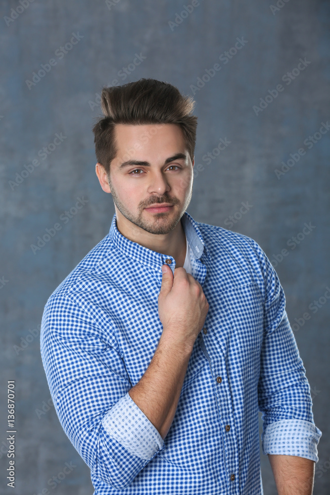 Handsome young man on color background Stock Photo | Adobe Stock
