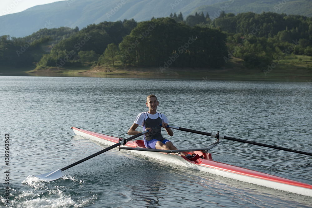 Child in the course of rowing on single Stock Photo | Adobe Stock