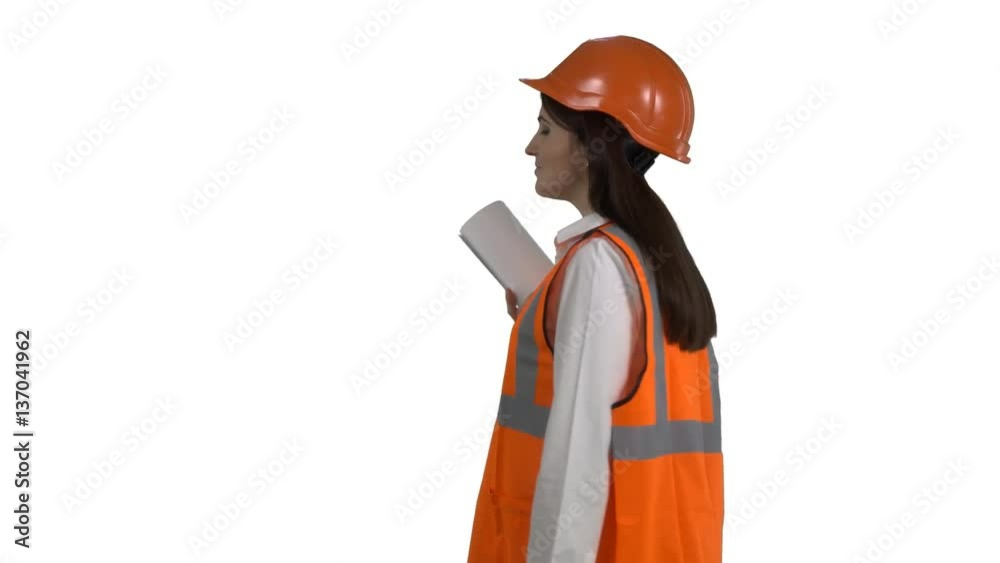 Female construction worker on white background. Confident woman in orange safety vest and hard ...
