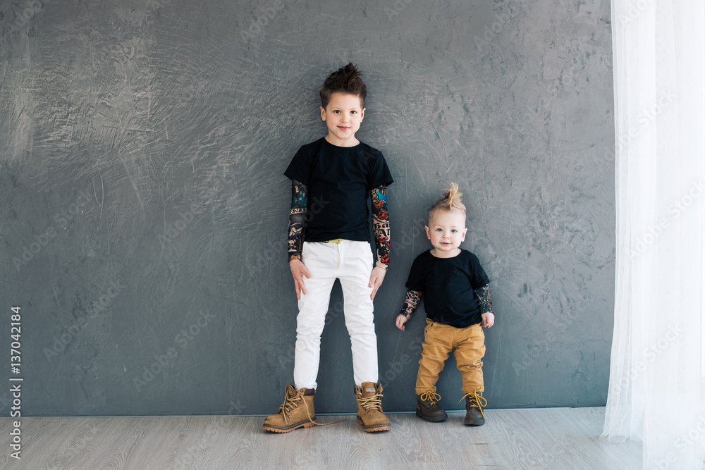 Two fashionable brother. They are stylish and beautiful. Stock Photo ...