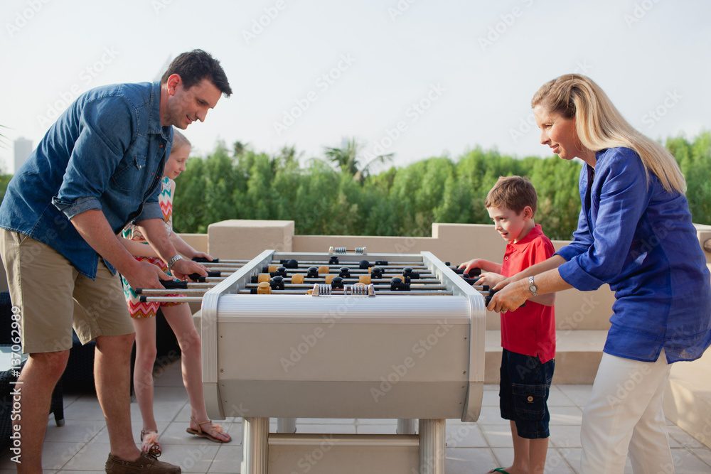 Family Playing Foosball