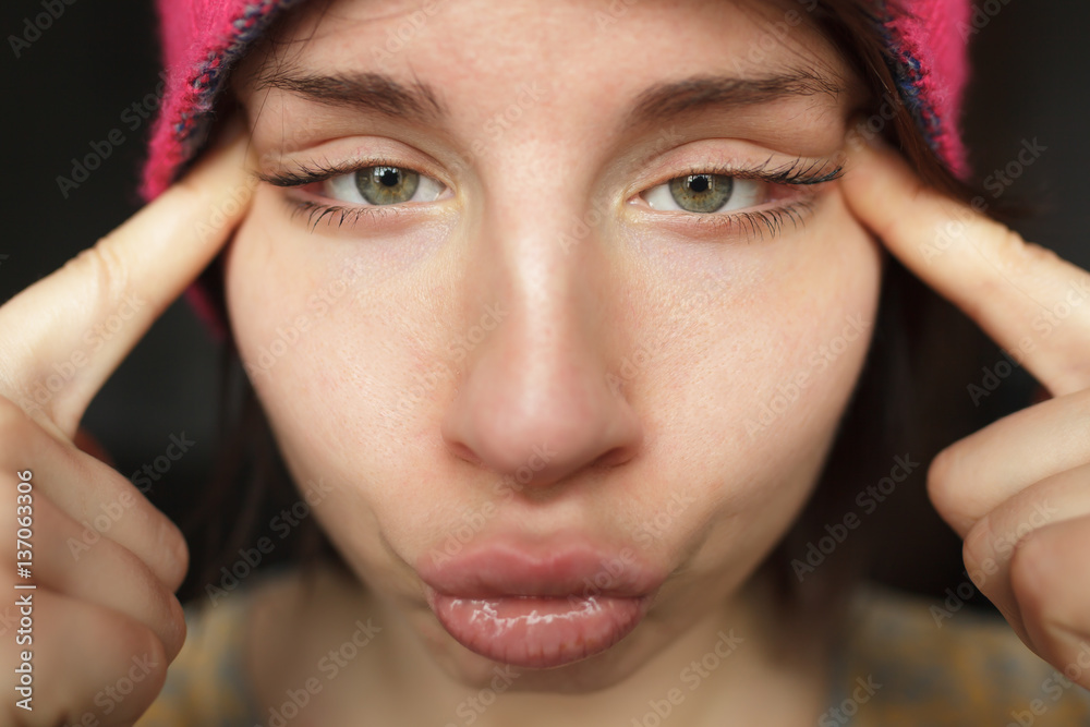 Girl with big lips poses faces. Pulling her lips Stock Photo | Adobe Stock