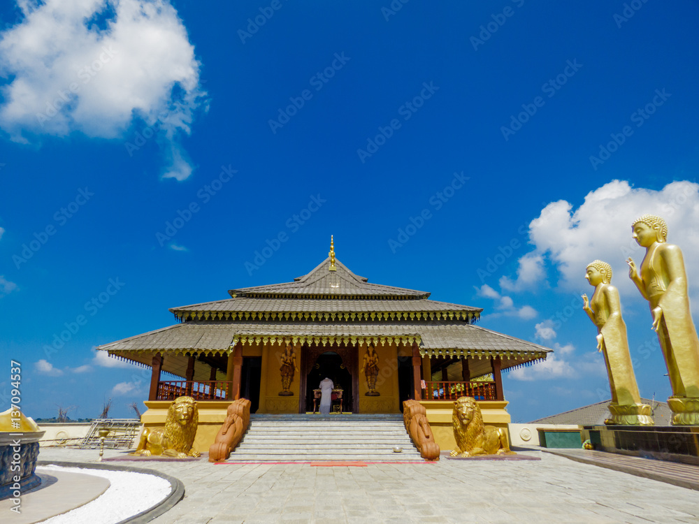 Golden Temple Palace Relic House with series of golden Standing Buddha ...
