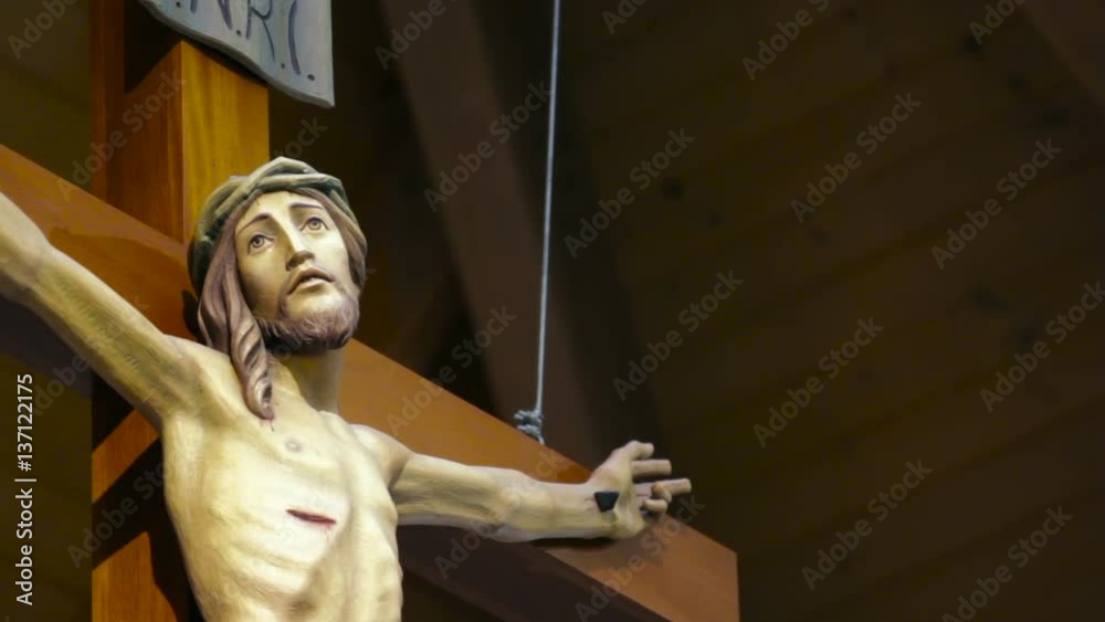 Statue of Jesus hanging on the cross inside a church. Stock Video ...