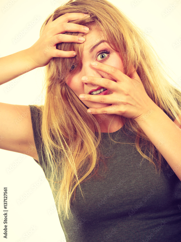 Ashamed embarrassed blonde woman with hands on face Stock Photo | Adobe ...