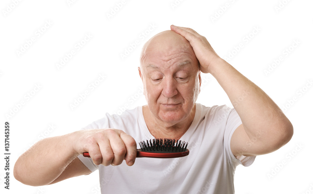 Bald senior man with hair brush on white background Stock Photo | Adobe ...