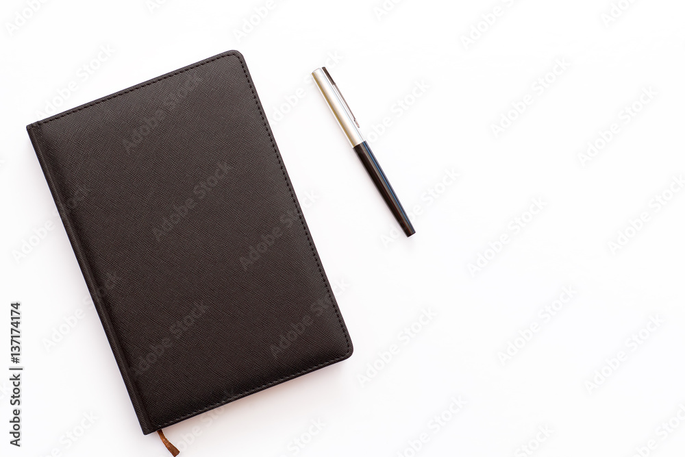 black diary and pen on a white background Stock Photo | Adobe Stock