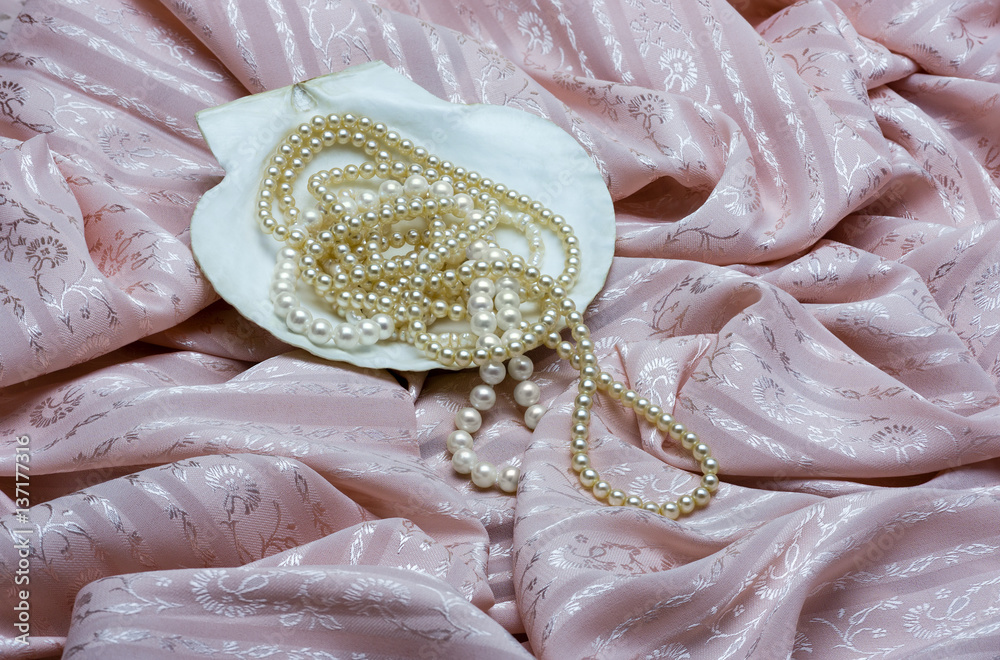 Pearl necklace on draped fabric Stock Photo | Adobe Stock